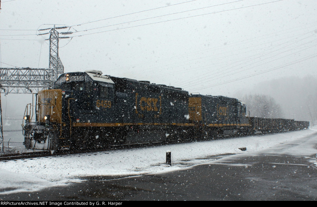 CSX 6459 on a work train in heavy snow. F00712